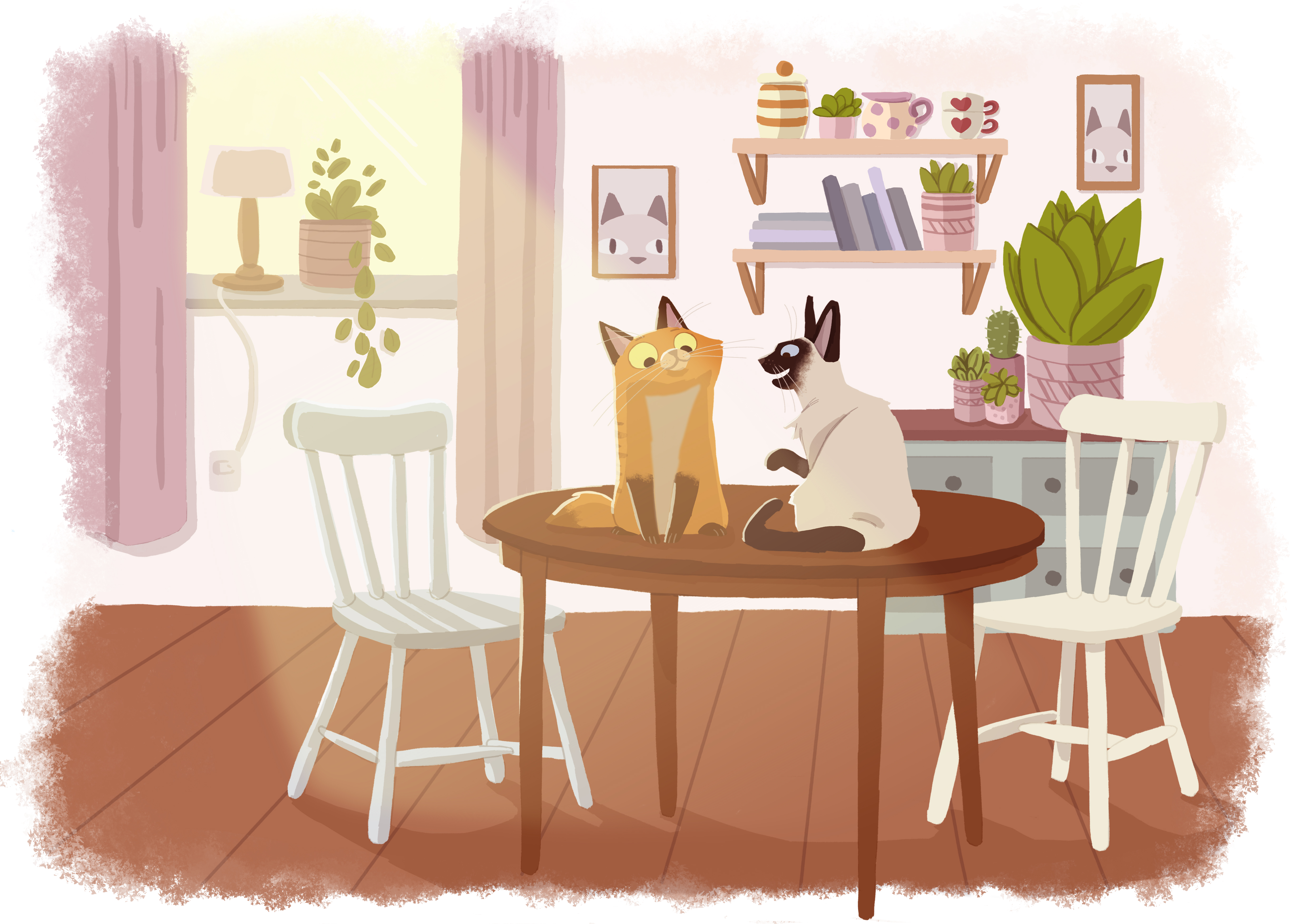 Der sad to katte på et bord